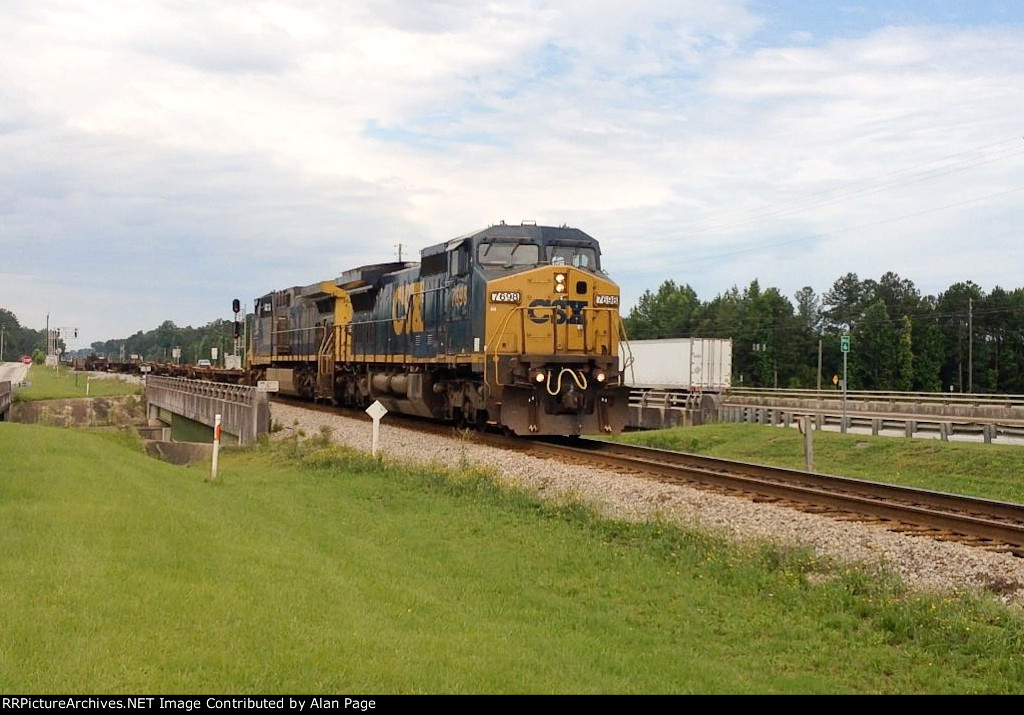 CSX 7698 heads across the Fairburn Industrial Boulevard over~ass